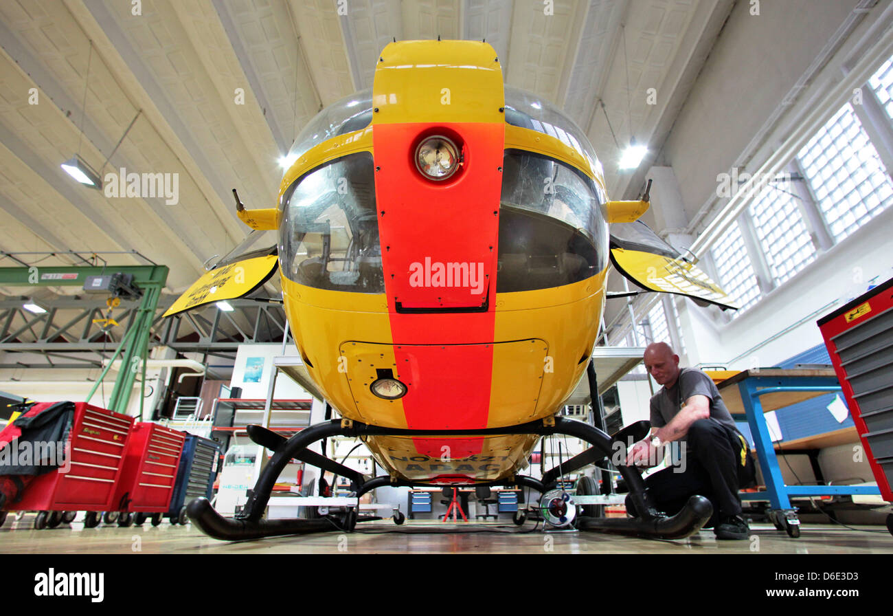 Aircraft mechanic Frank Barth maintains an ADAC rescue helicopter of ...