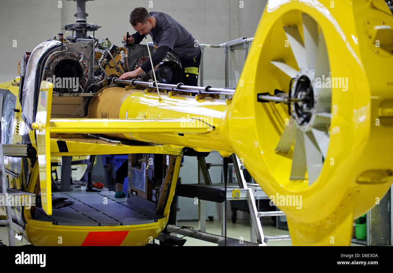 Aircraft mechanic Michael Straube maintains an ADAC rescue helicopter ...