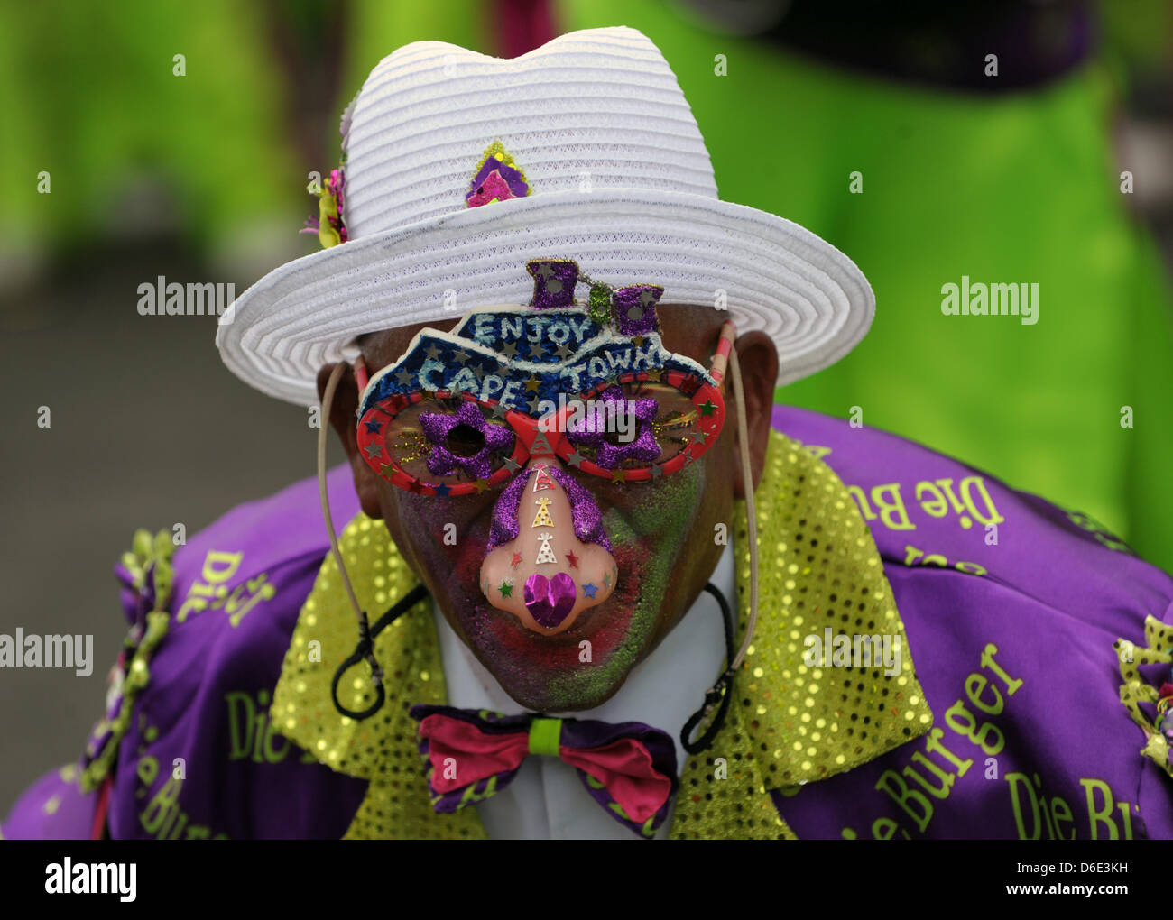 A participant of the tradition Cape Coon Carneval looks into the camera ...