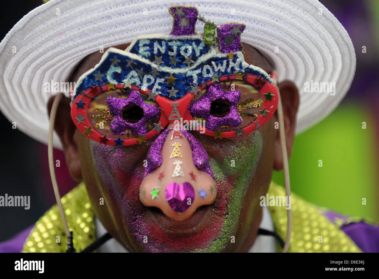 A participant of the tradition Cape Coon Carneval looks into the camera ...