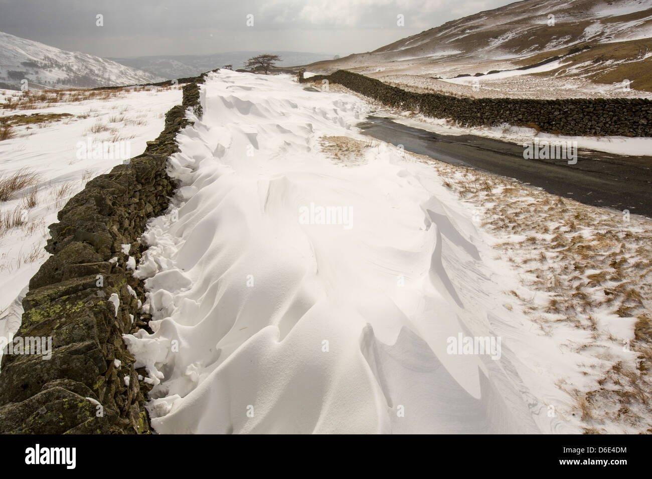 Massive snow drifts block the Kirkstone Pass road above Ambleside in ...