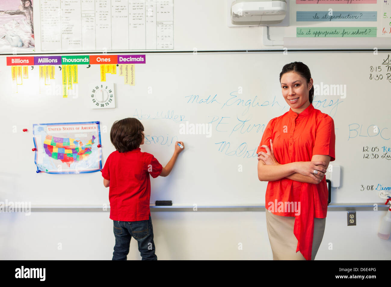 Teacher standing front whiteboard hi-res stock photography and images ...