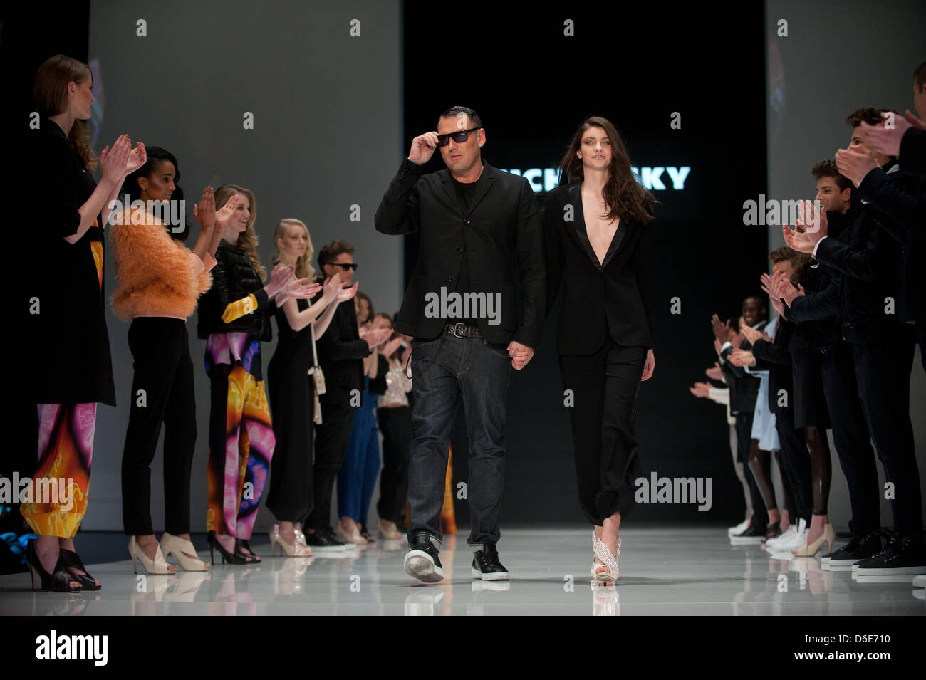 Designer Michael Michalsky and models present a creation of Michalsky ...