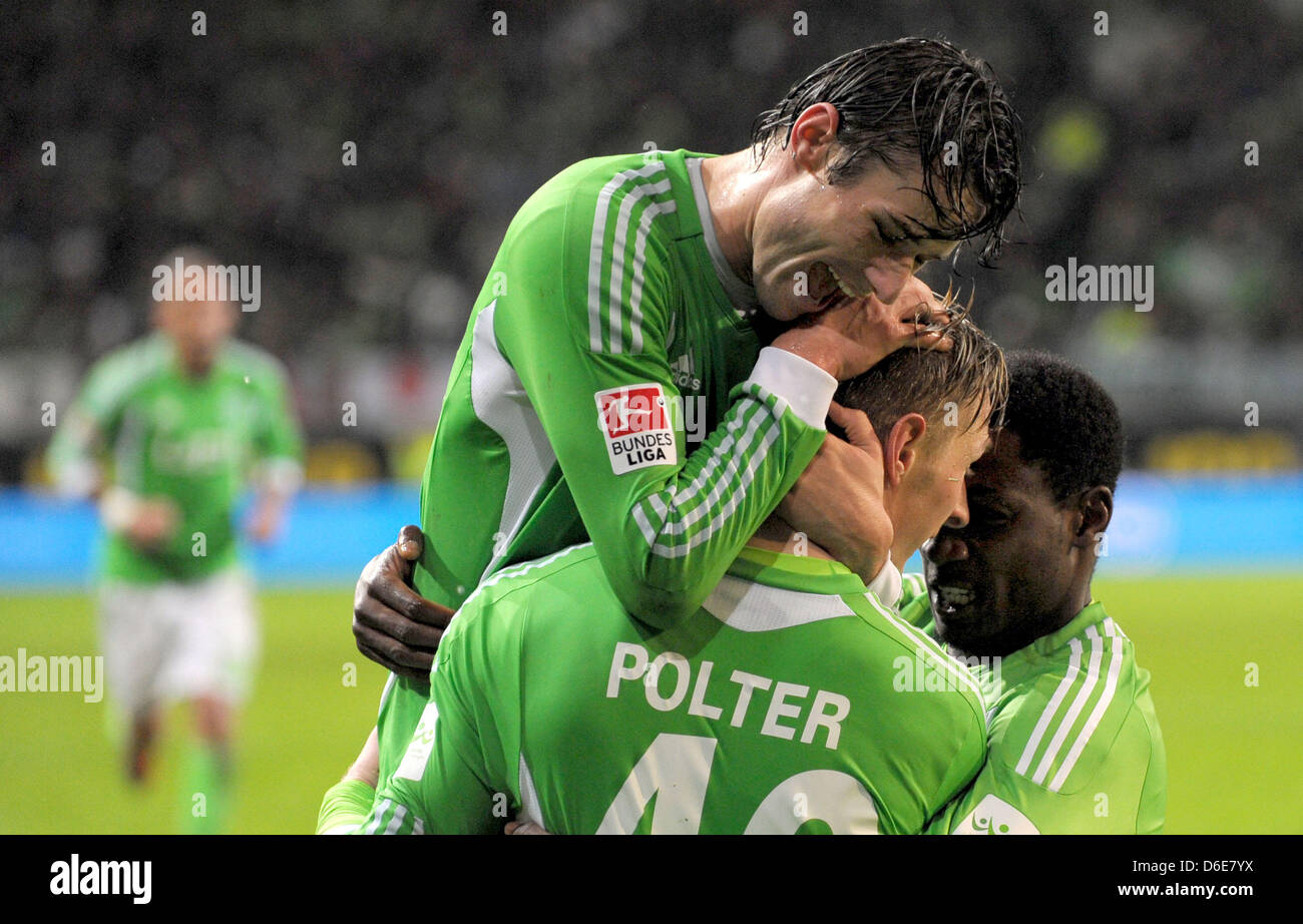 Wolfsburg's Sebastian Polter (C) celebrates his 1-0 goal with Christian ...