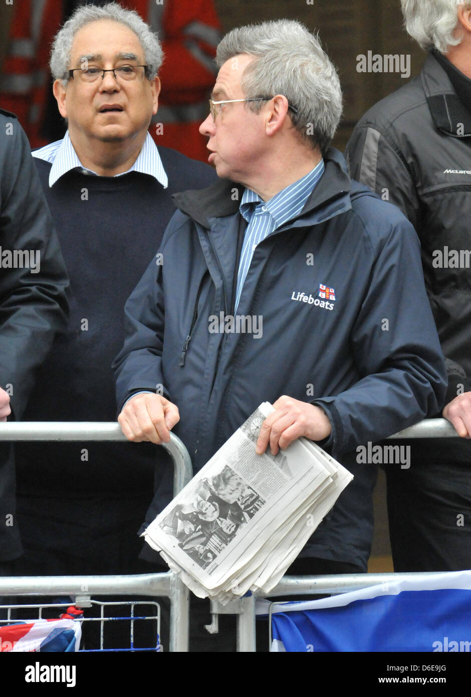 Ludgate Hill, London, UK. 17th April 2013. A man holds newspaper with a ...