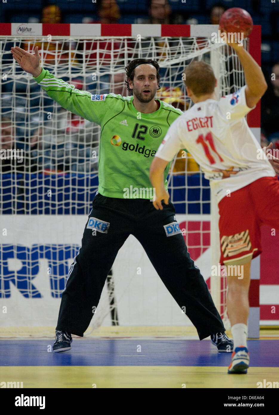 Germany's goalkeeper Silvio Heinevetter (L) competes against Denmark's ...