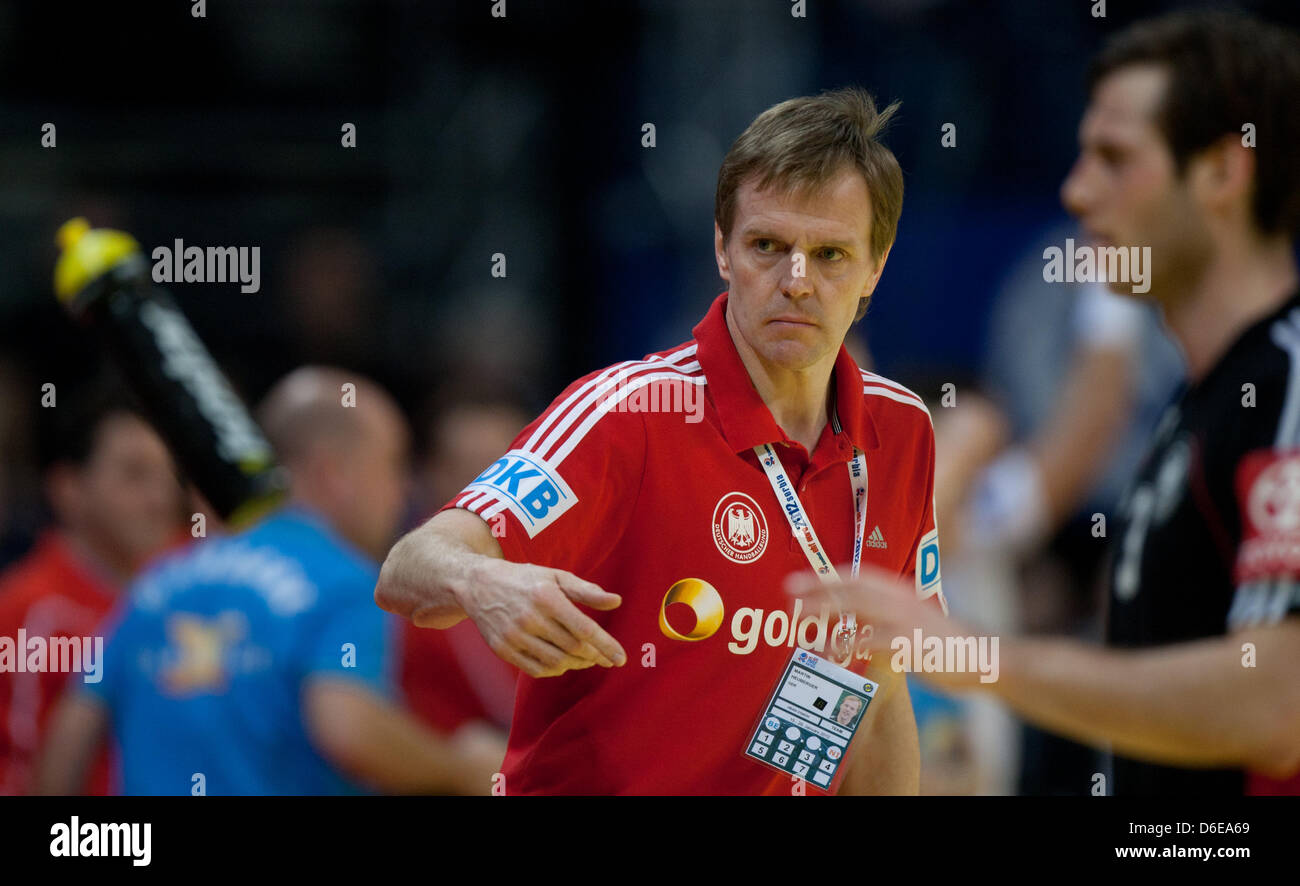 Germany's national handball coach Martin Heuberger acts on the sideline ...