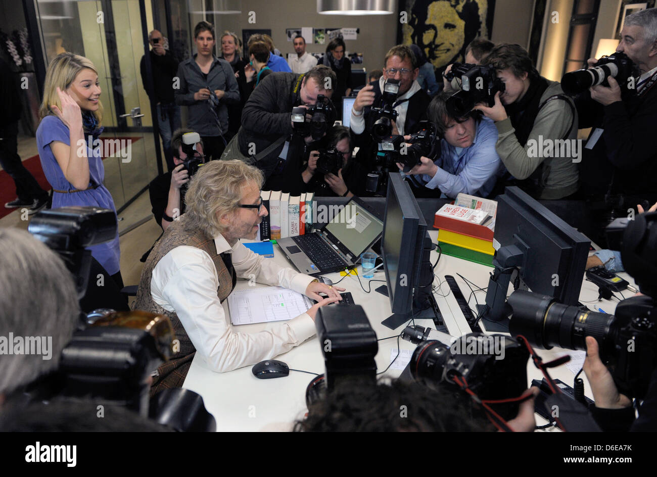 Surrounded by photographers TV presenter Thomas Gottschalk and ...