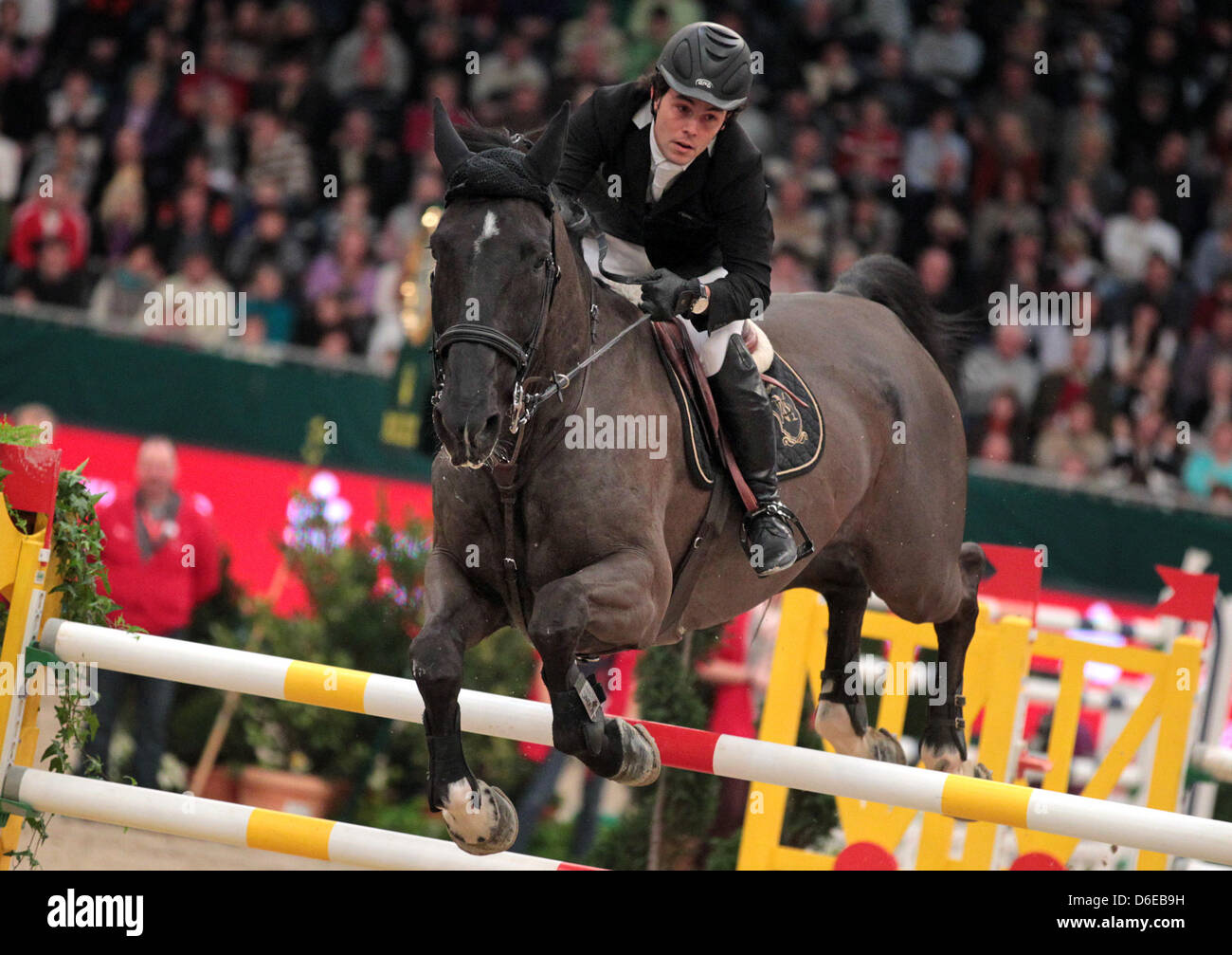 Spanish rider Sergio Alvarez Moya jumps over a hurdle on Wisconsin 111 ...