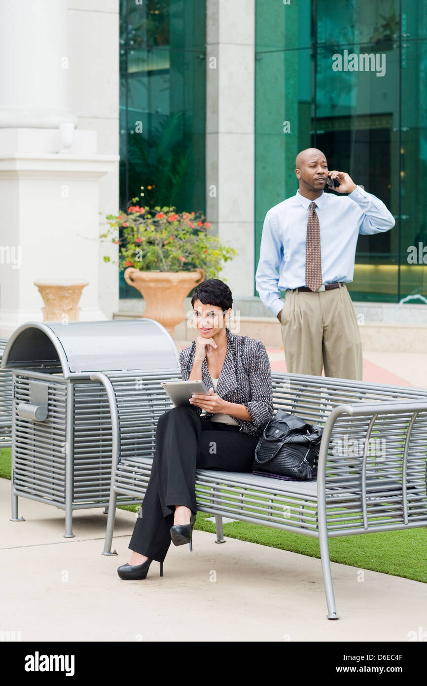 Business people working outdoors Stock Photo - Alamy