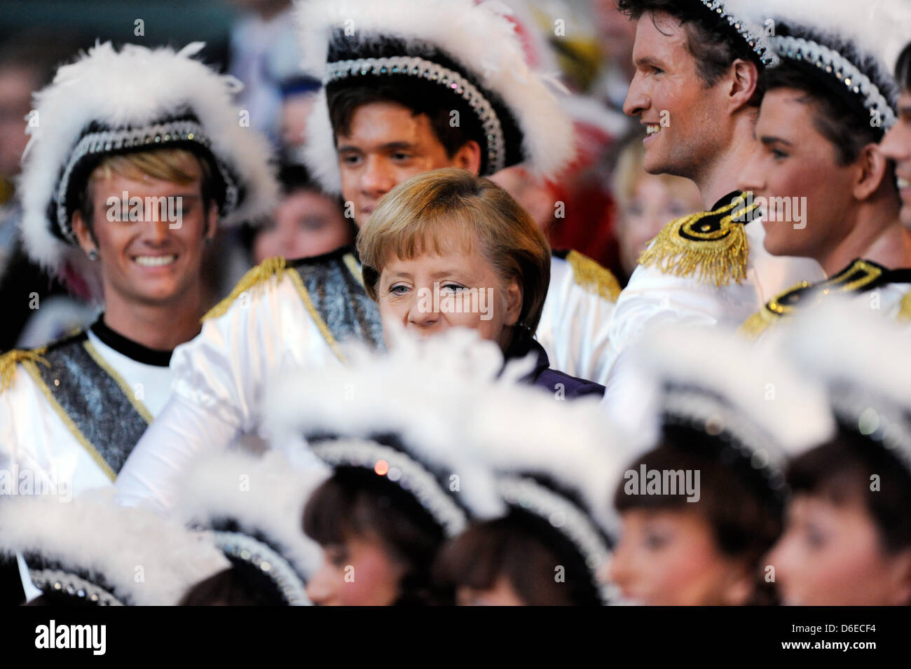 German Chancellor Angela Merkel (CDU, C) stands amidst a group of ...