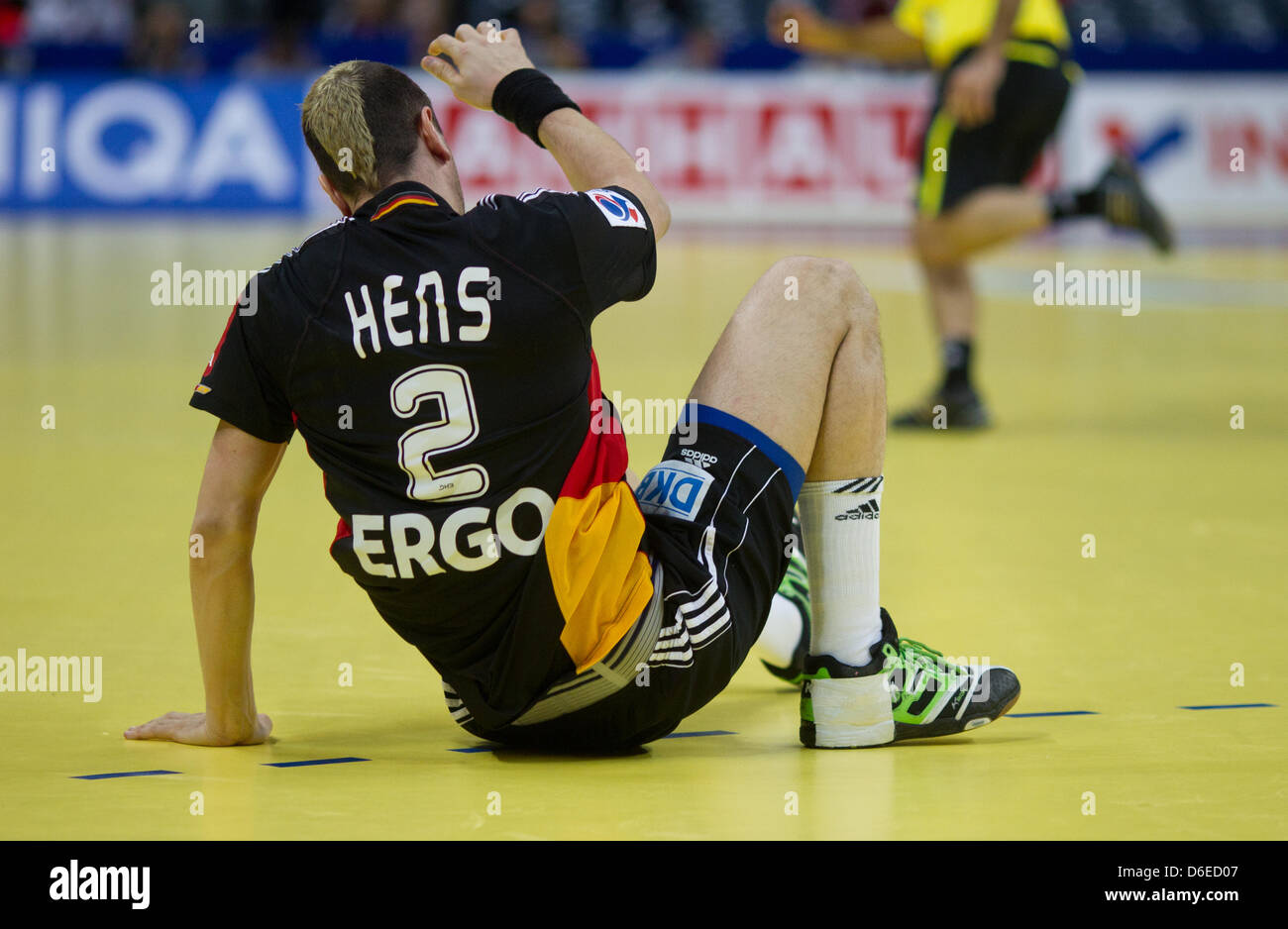 Germany's Pascal Hens sits on the court during the group 1 match ...