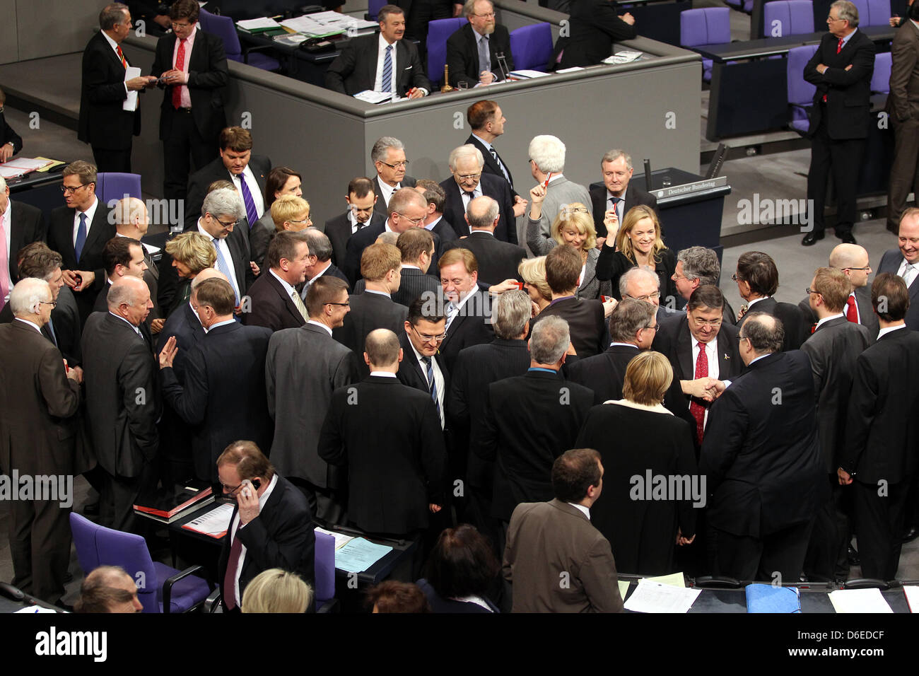 Members of the German Parliament cast their vote after a debate on the ...