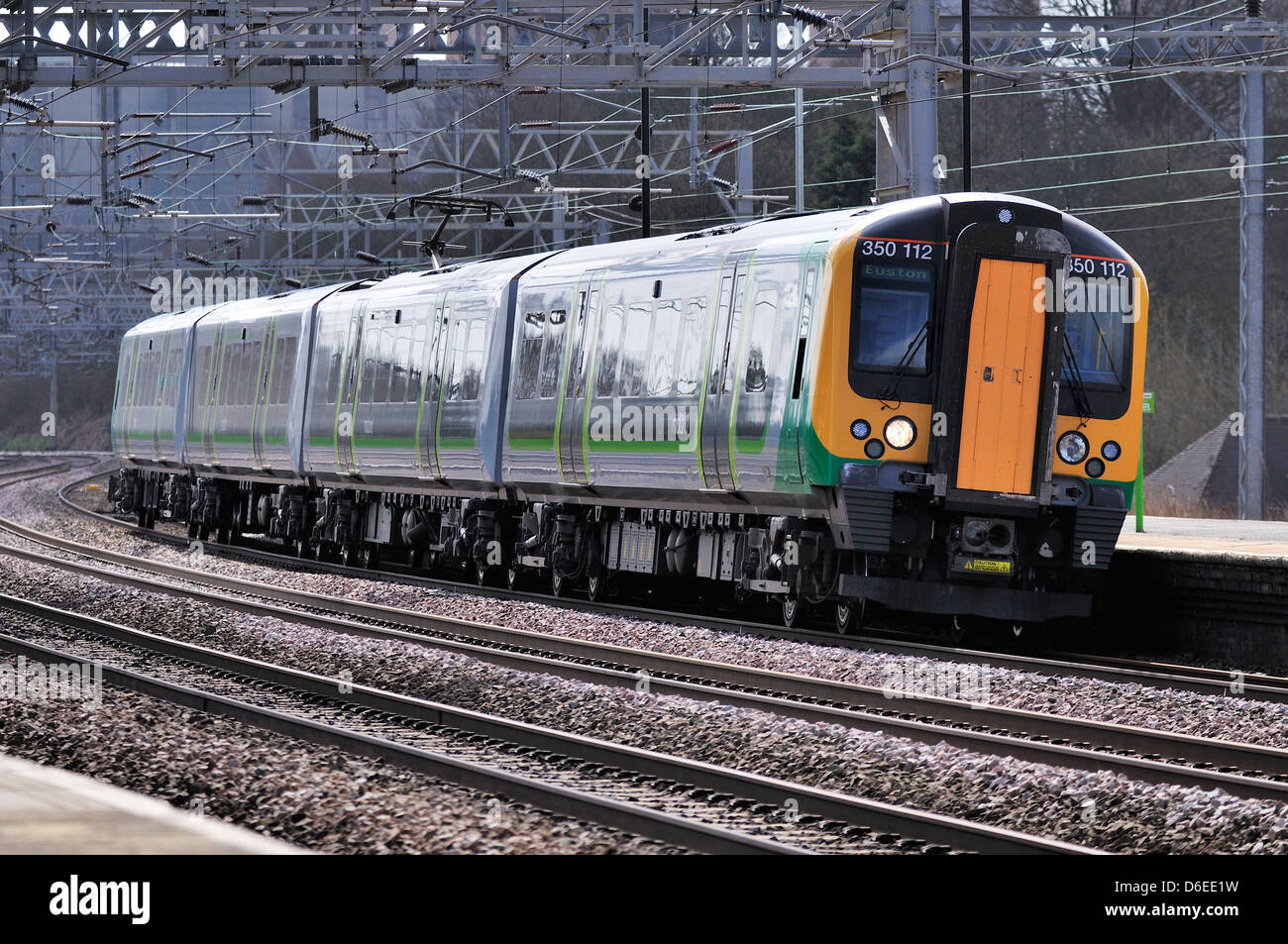 London Midland local passenger train stopped in the platform at Rugeley ...