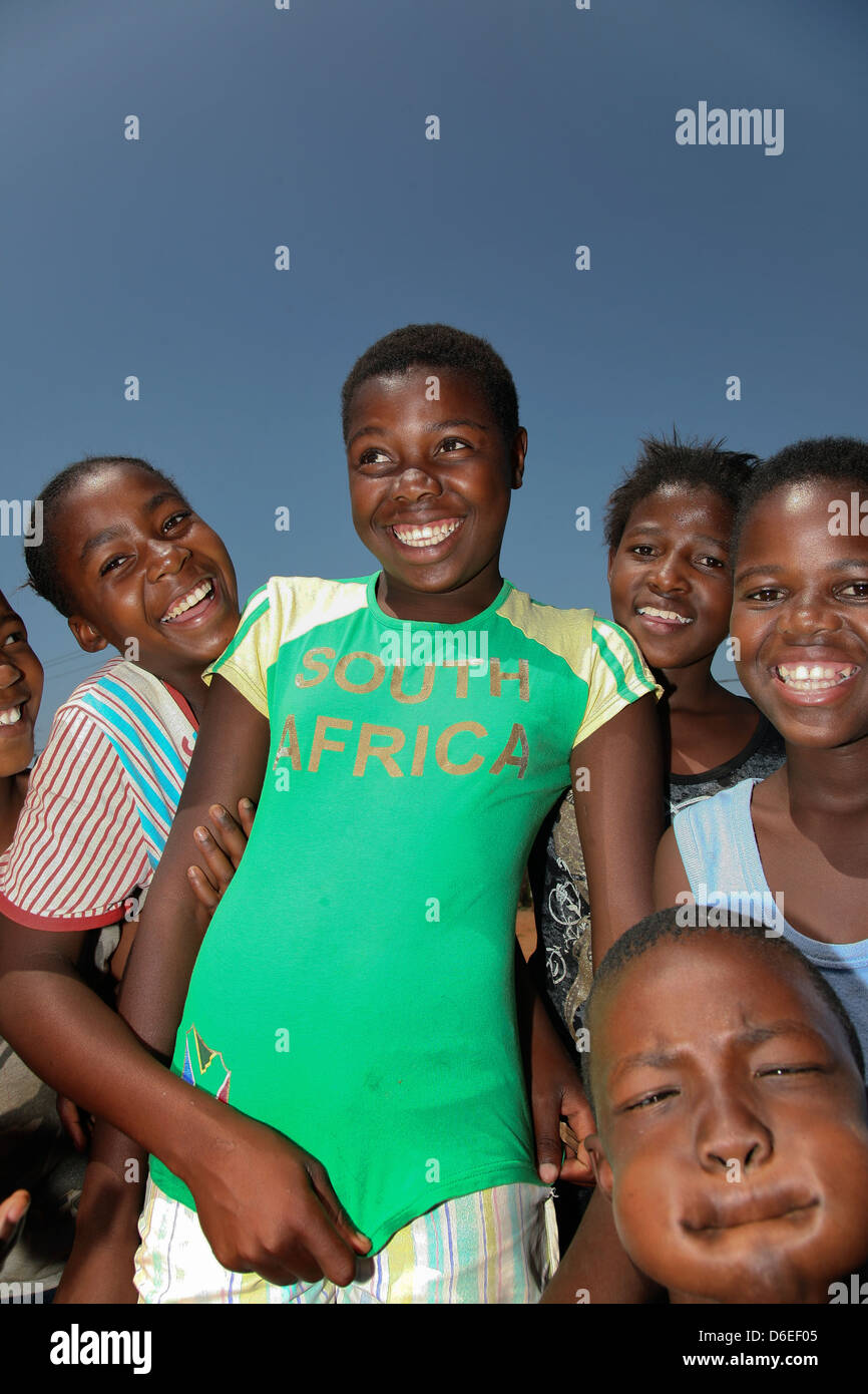 Portrait of African children playing on the dirt road Stock Photo - Alamy