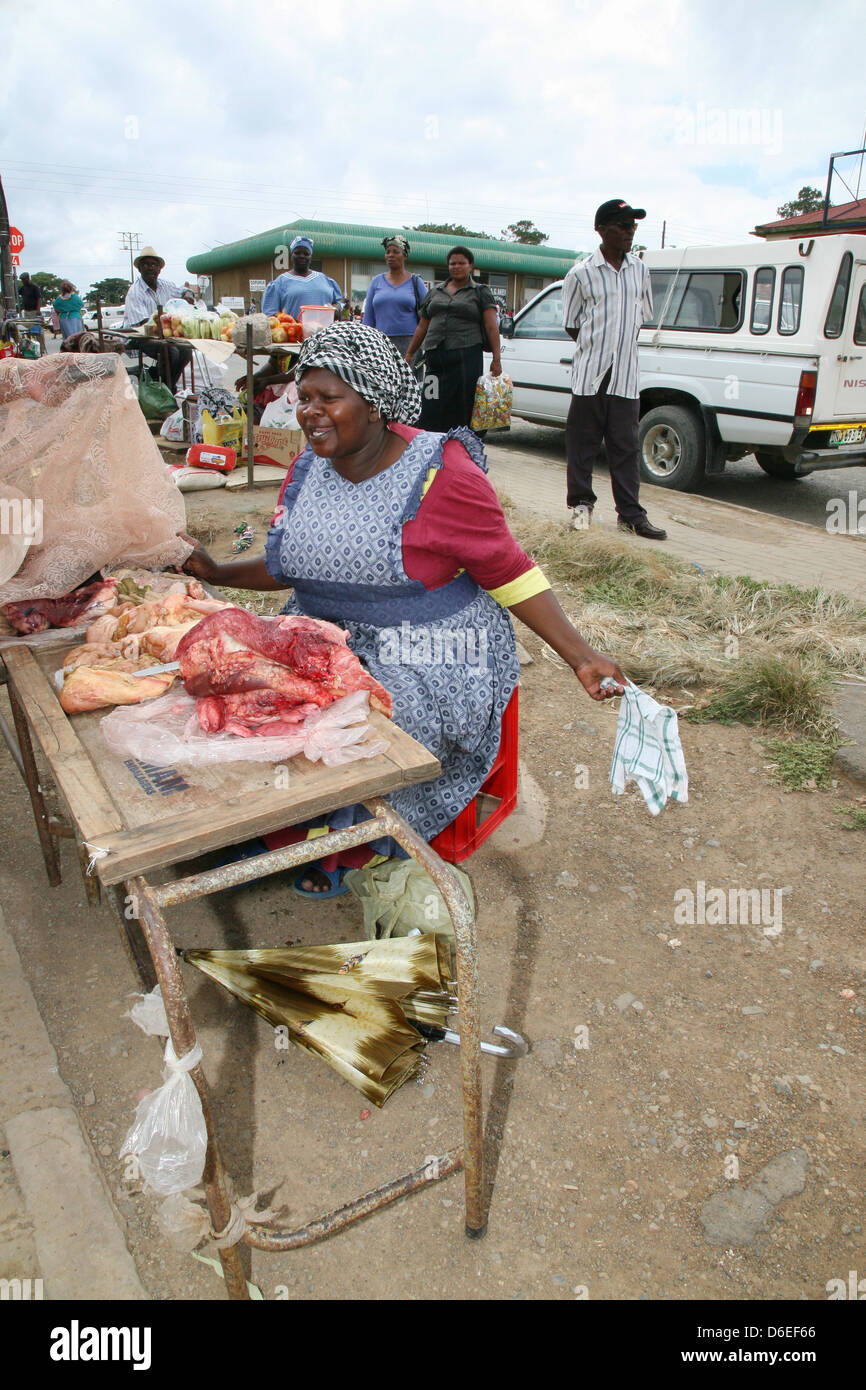 African woman selling sheep meat at a stall Stock Photo - Alamy