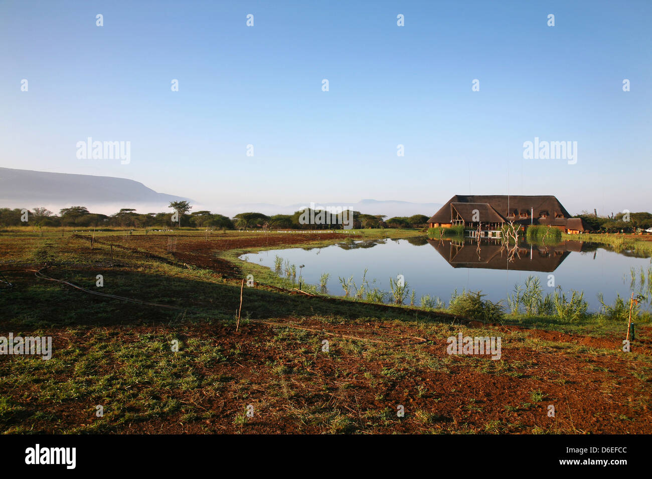 flat landscape with dam and building Stock Photo - Alamy
