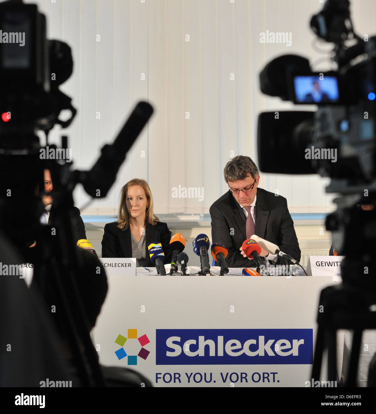Meike Schlecker and bankruptcy trustee Arndt Geiwitz attend a press ...