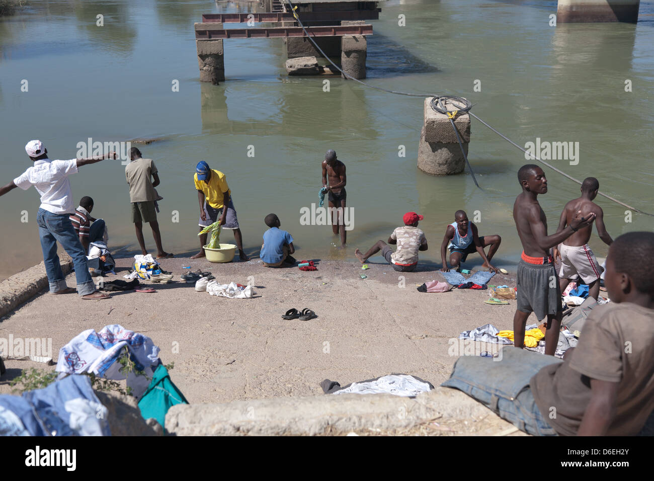 African community doing washing up in the river Stock Photo - Alamy