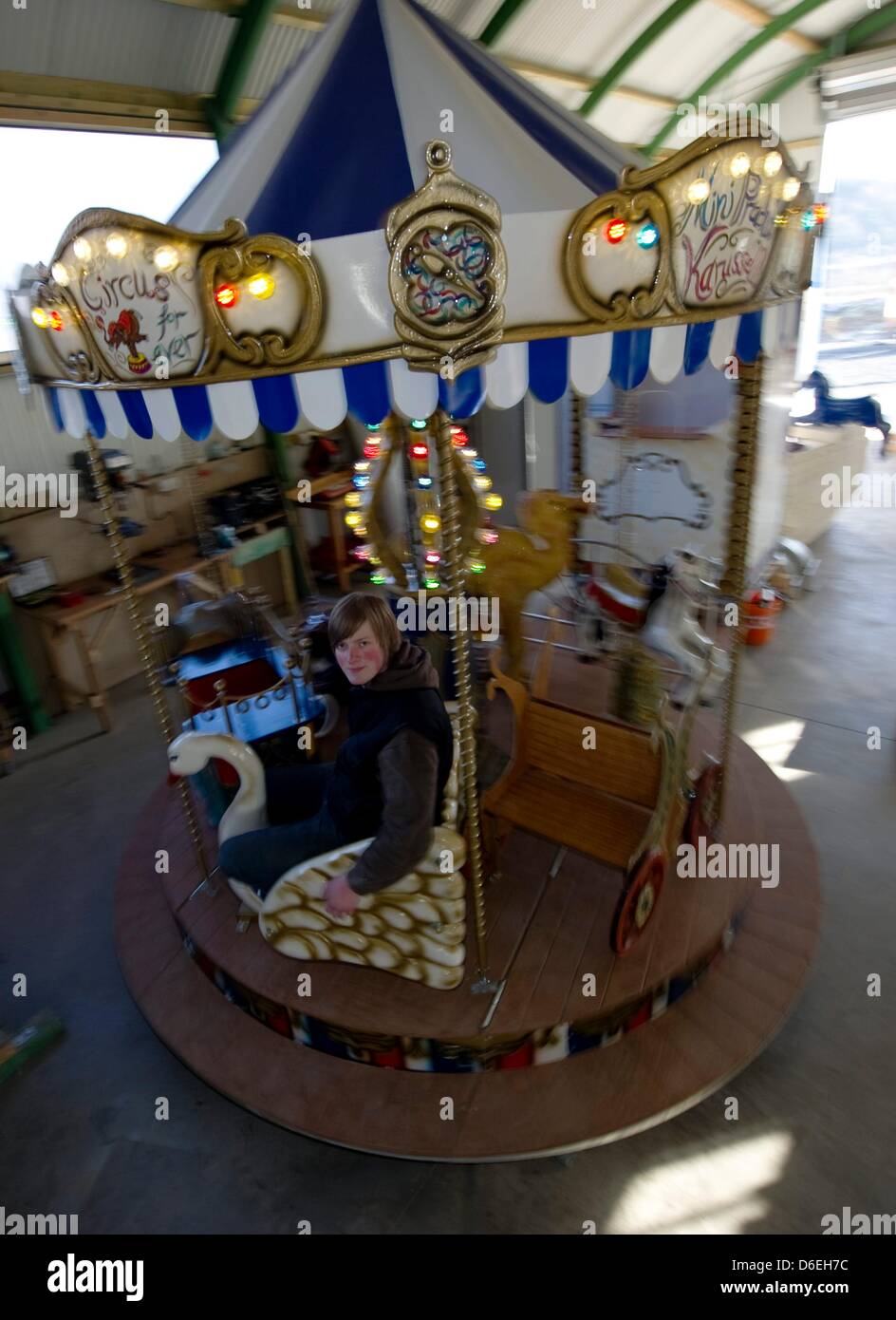 Carousel builder John Heinz rides one of his carousels in Breidenbach ...