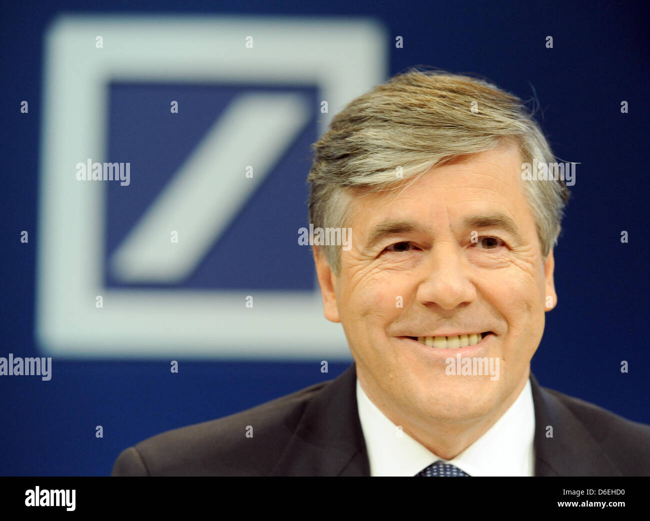 Josef Ackermann, CEO of the Deutschen Bank, looks at his watch at his ...