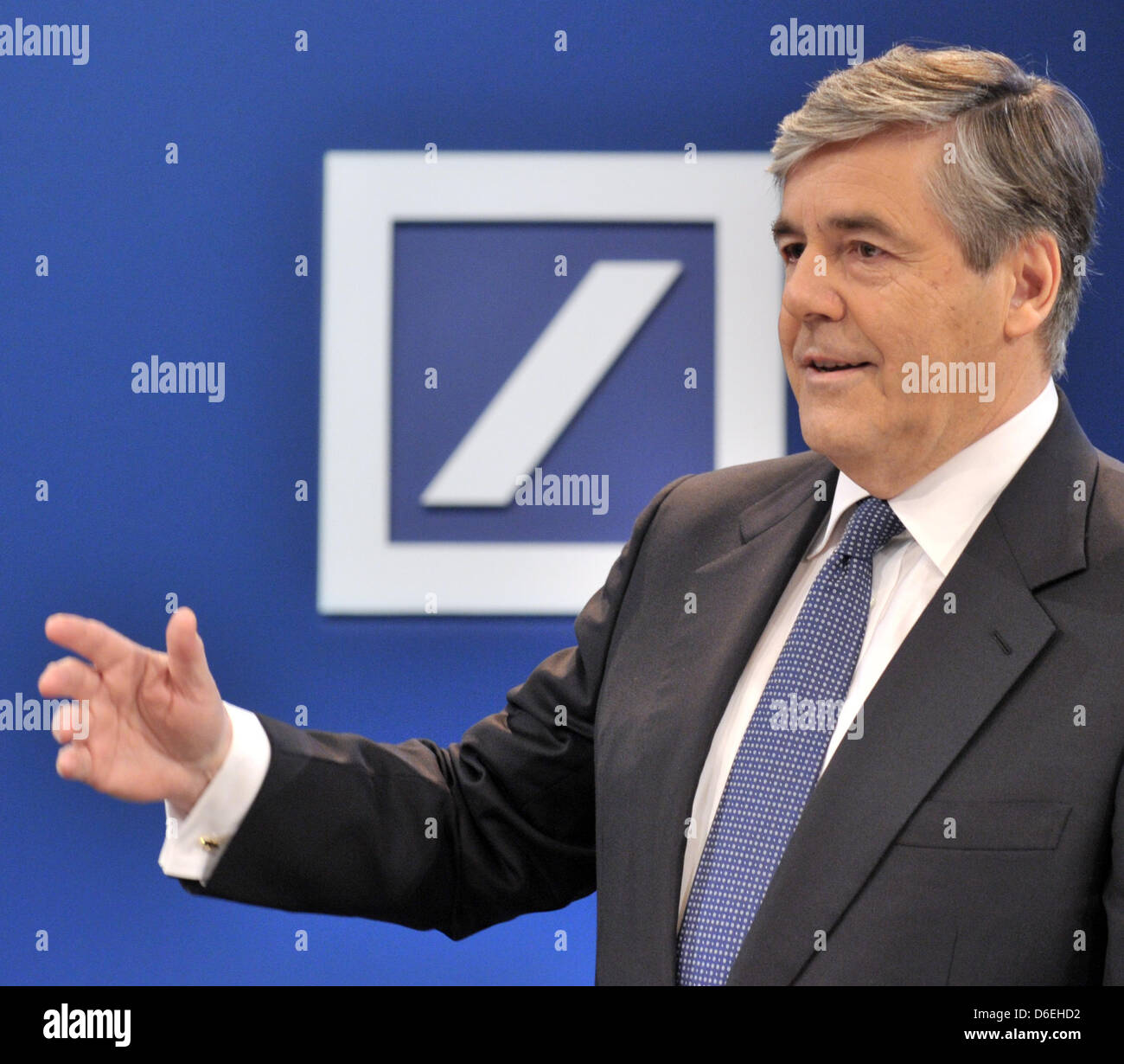 Josef Ackermann, CEO of the Deutschen Bank, looks at his watch at his ...