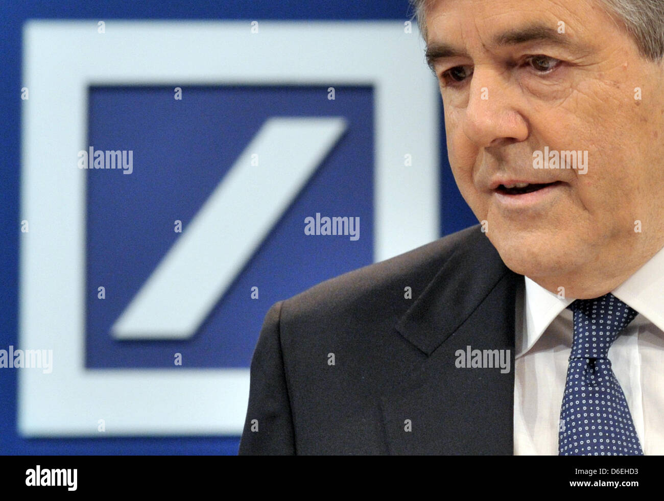Josef Ackermann, CEO of the Deutschen Bank, looks at his watch at his ...