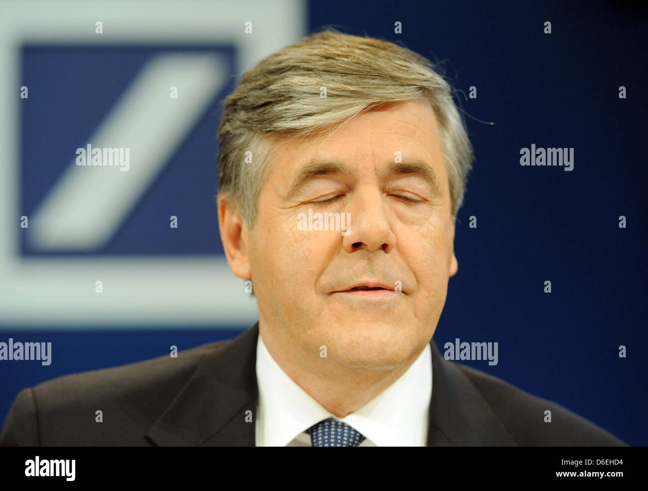 Josef Ackermann, CEO of the Deutschen Bank, looks at his watch at his ...