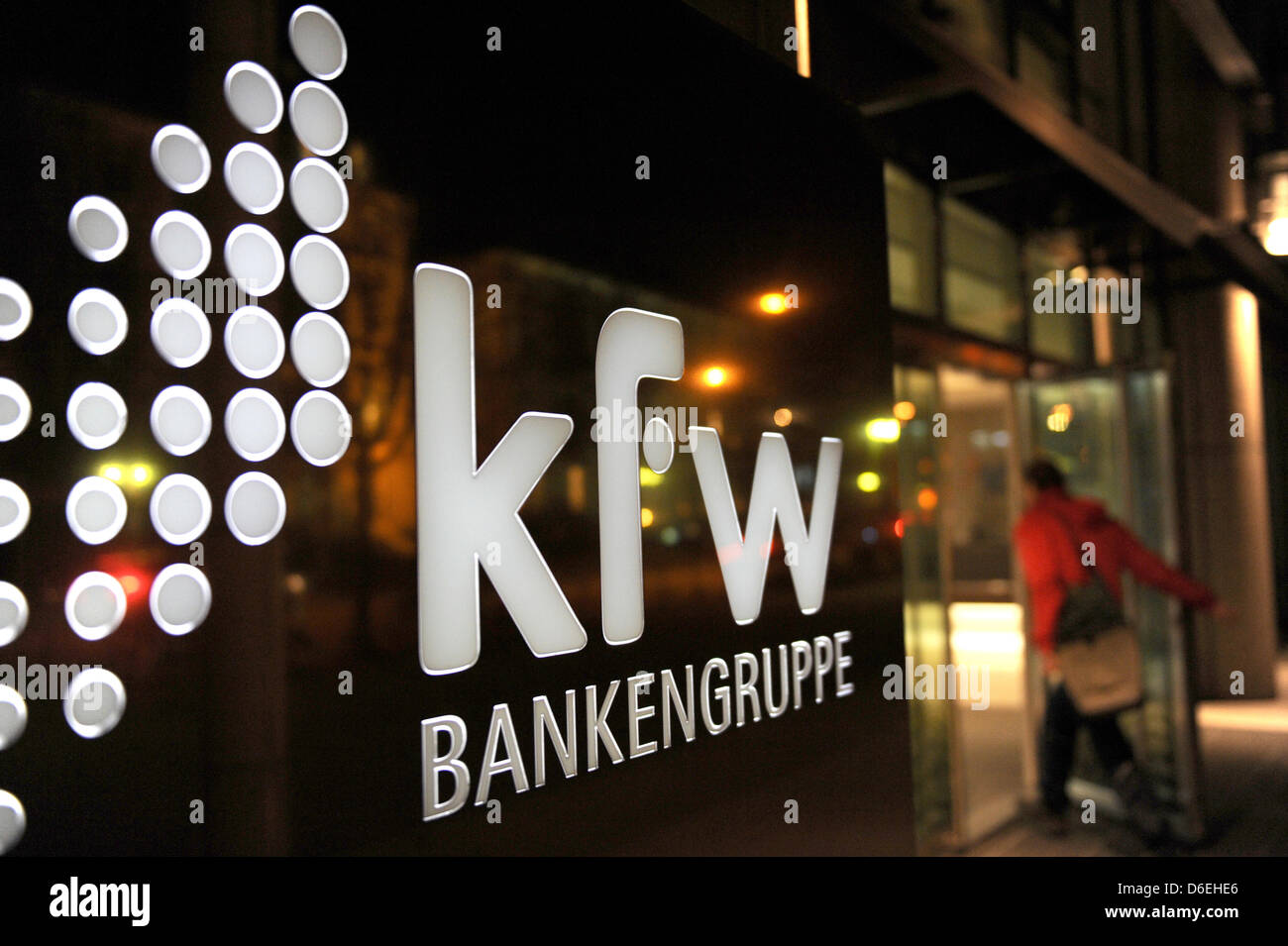 A man enters the building of the KfW - Kreditanstalt für Wiederaufbau ...