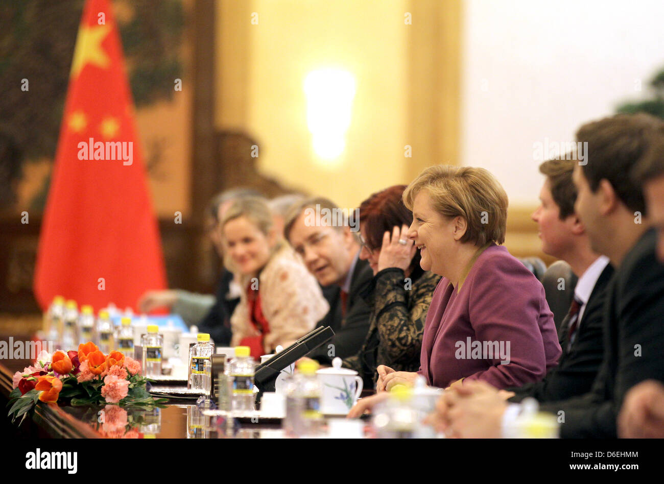 German Chancellor Angela Merkel (CDU, 3-R) laughs during talks with ...