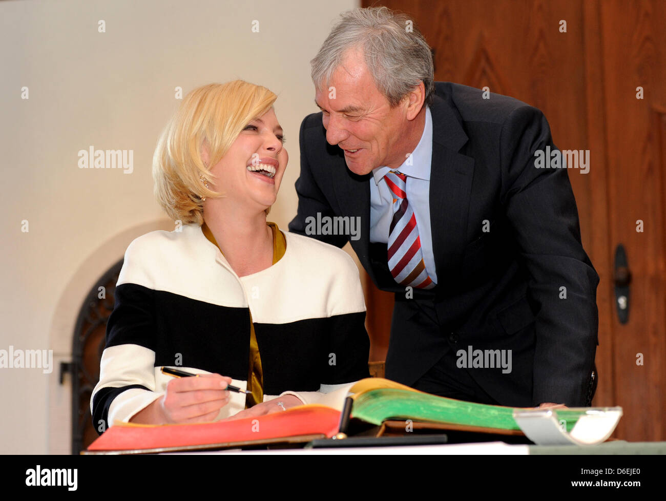 US actress Katherine Heigl signs her name into the golden book of the ...