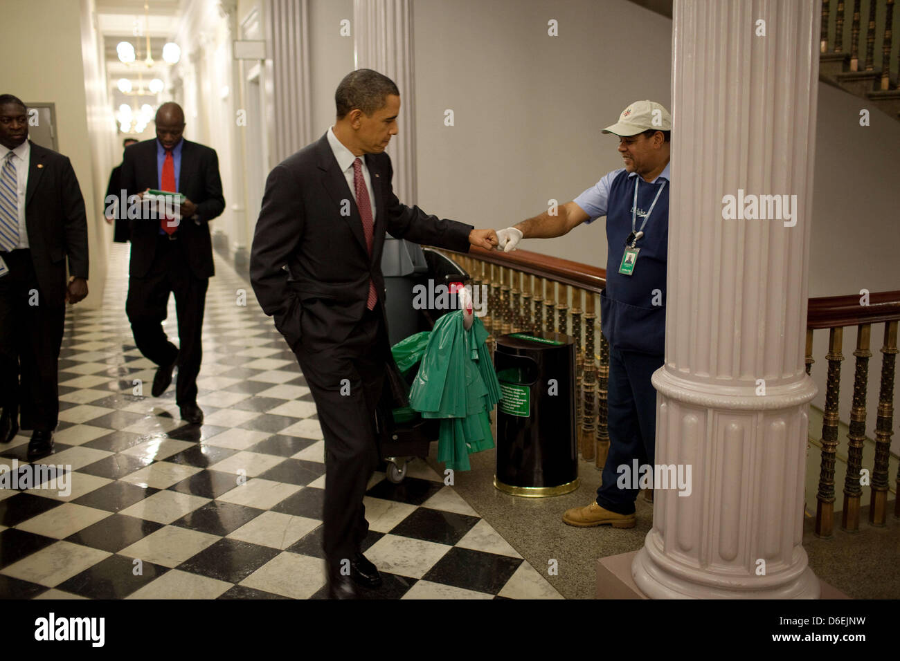 President Barack Obama fist-bumps custodian Lawrence Lipscomb in the ...