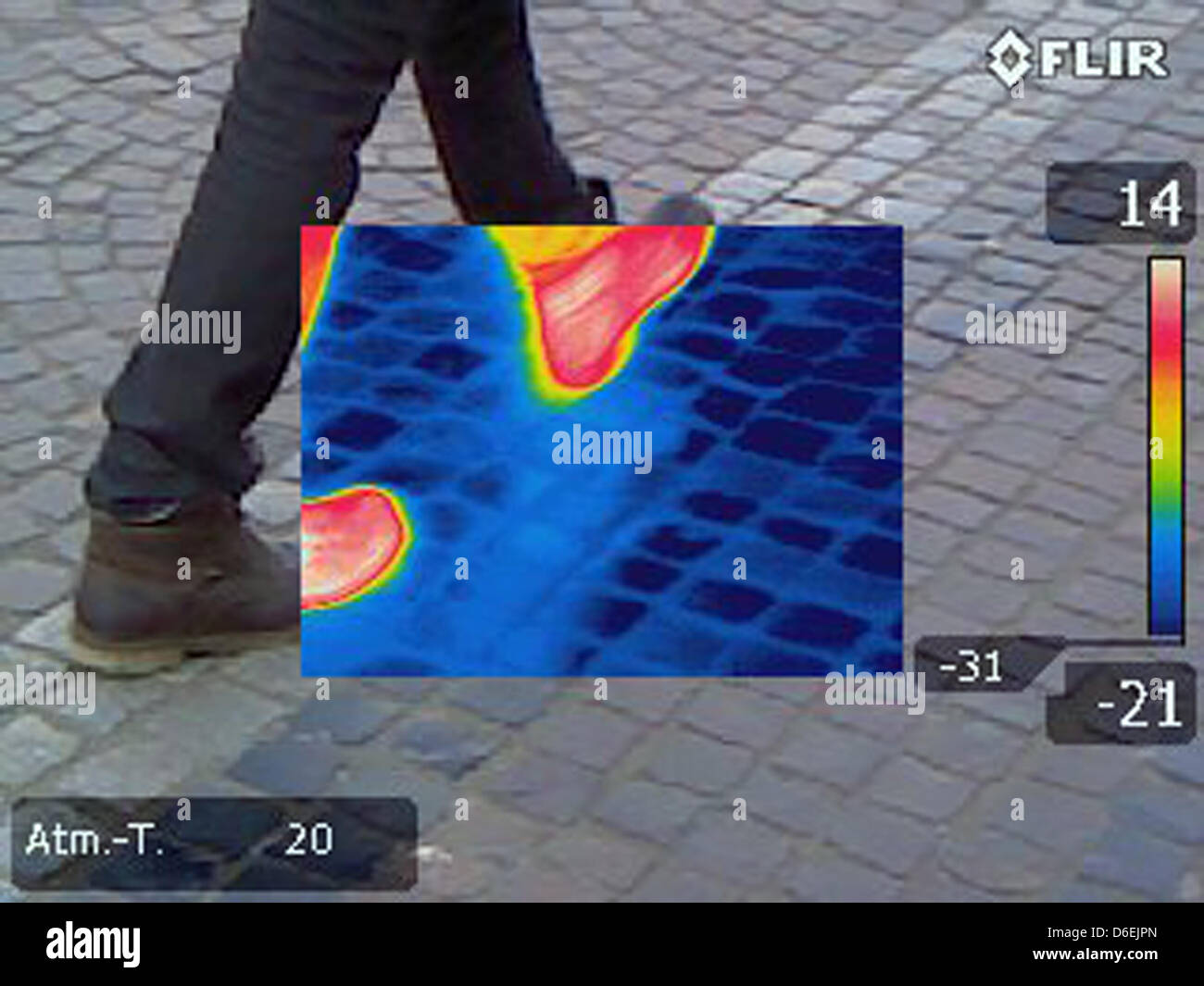 A thermographic image made with a thermal imaging camera shows a man ...