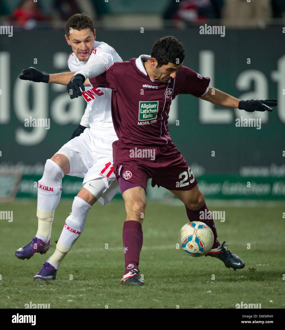 Cologne's Milivoje Novakovic (L) vies for the ball with Kaiserslautern ...