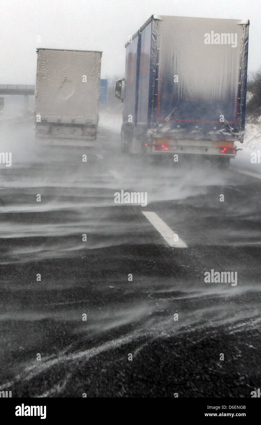 Lorries drive in snow on the A96 Autobahn near Erkheim, Germany, 07 ...