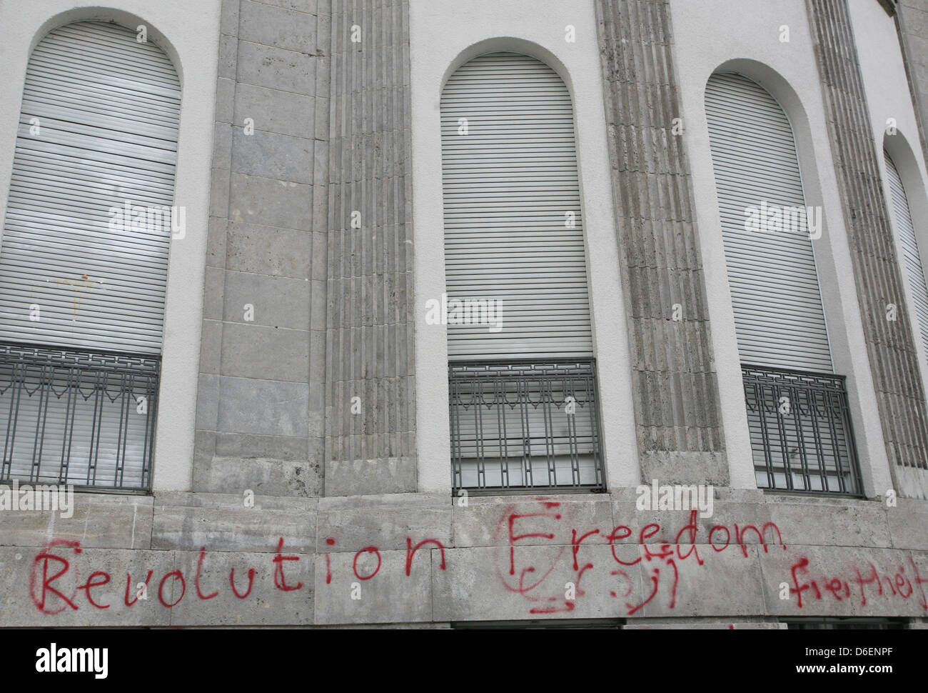 The words 'Freedom' and 'Revolution' are written on the wall of the ...