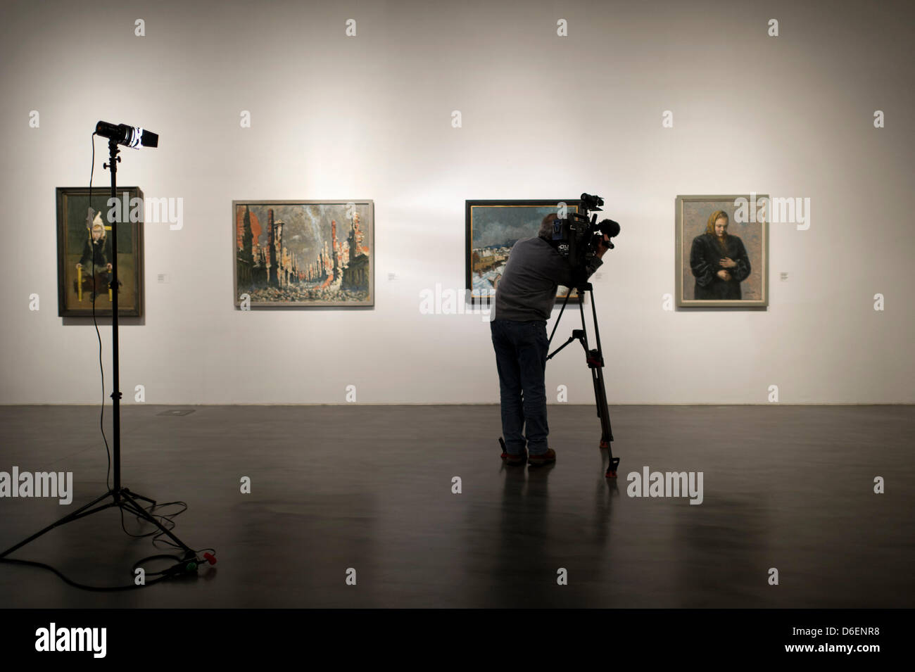 A camera man films the painting 'Child on yellow chair' by Theodor ...