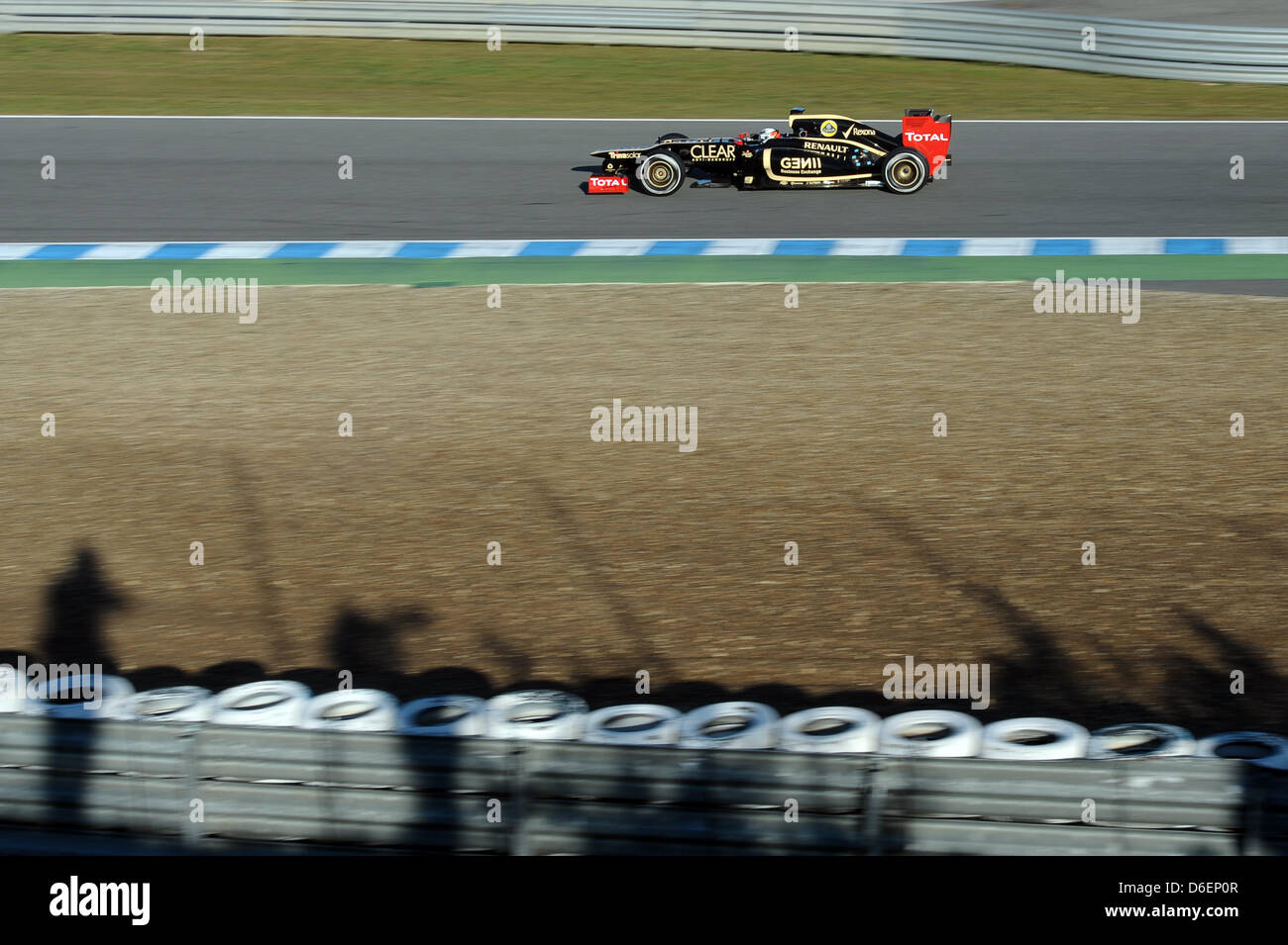 Finnish Formula One driver Kimi Raikkonen of Lotus steers his new E20 ...