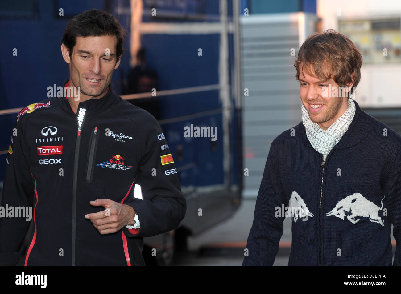 German Formula One driver Sebastian Vettel (R) of Red Bull and his team ...