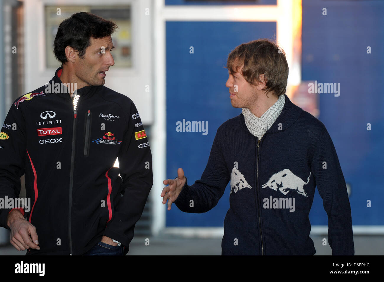 German Formula One driver Sebastian Vettel (R) of Red Bull and his team ...