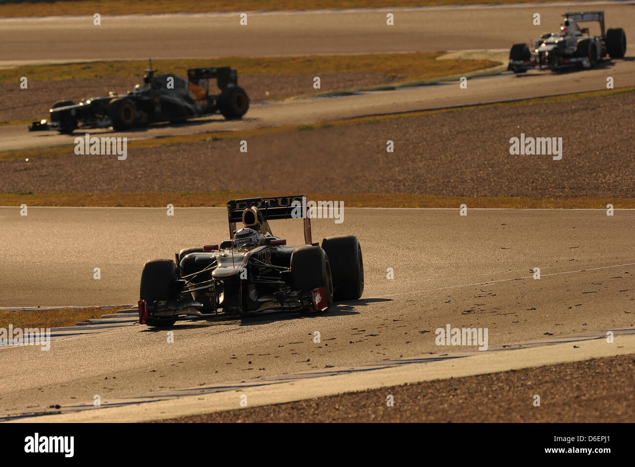 Finnish Formula One driver Kimi Raikkonen (front) of Lotus steers his ...