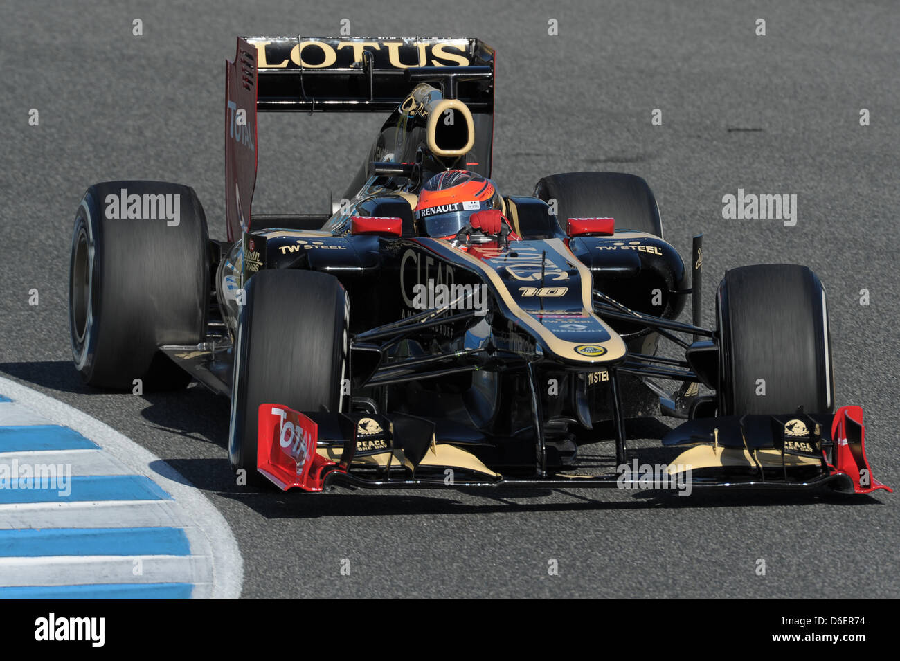 French Formula One driver Romain Grosjean of Lotus steers his new race ...