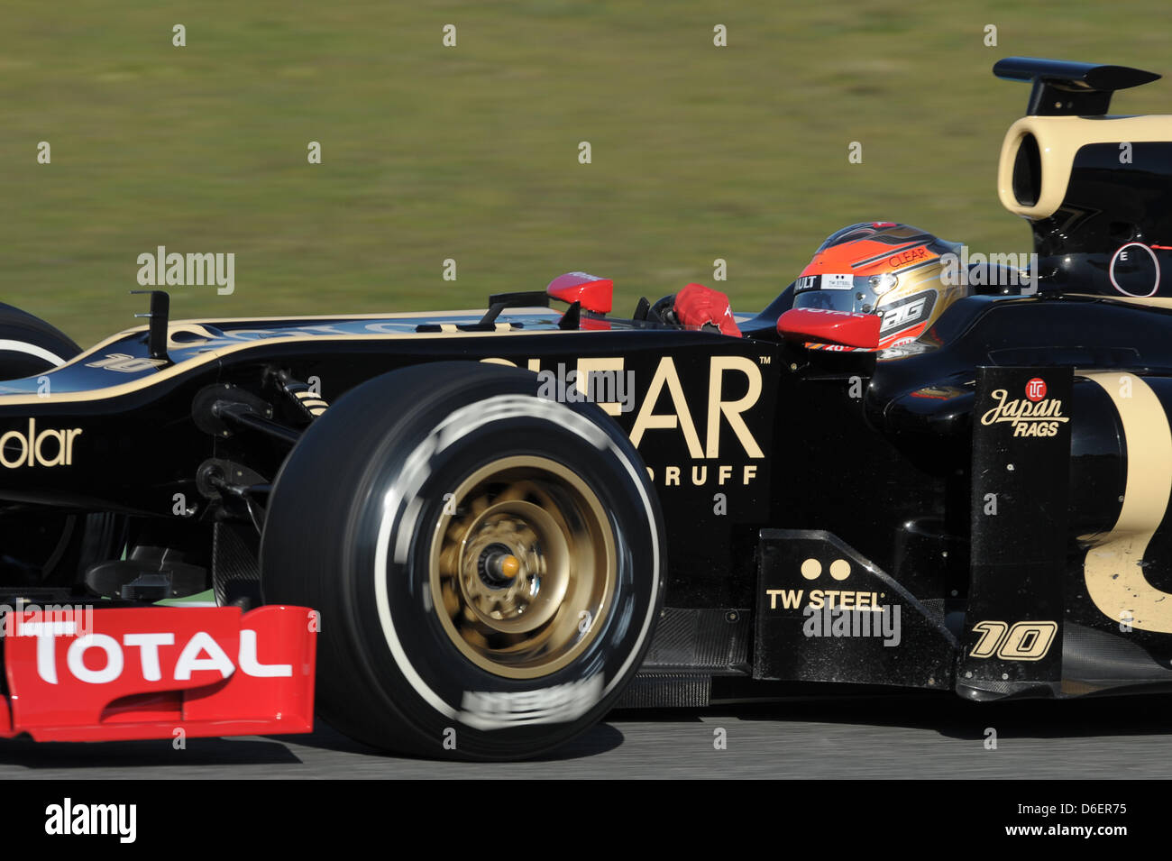 French Formula One driver Romain Grosjean of Lotus steers his new race ...