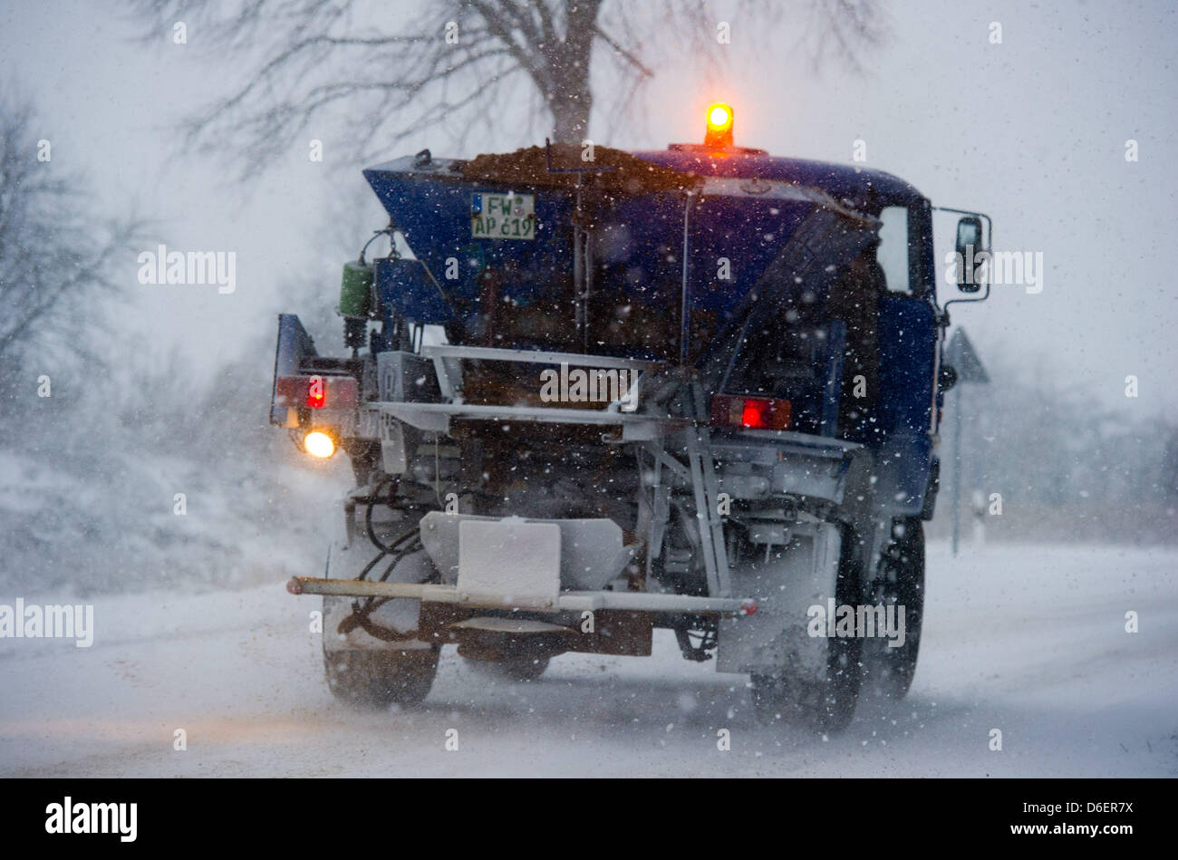 A gritting lorry of a private winter clearing service drives down a ...