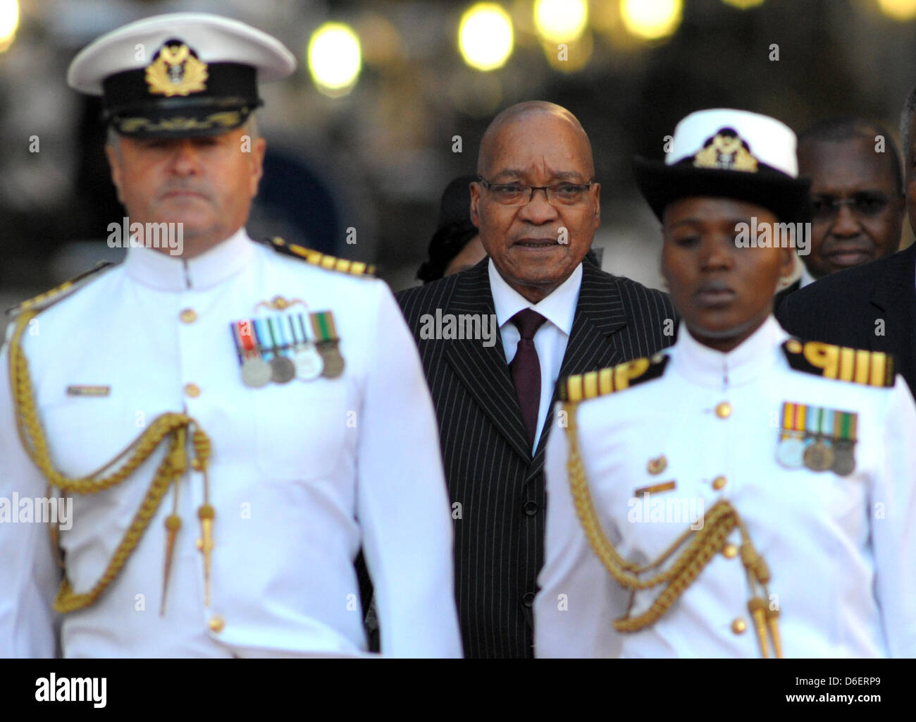 The South African President Jacob Zuma (C) walks accompanied by two ...