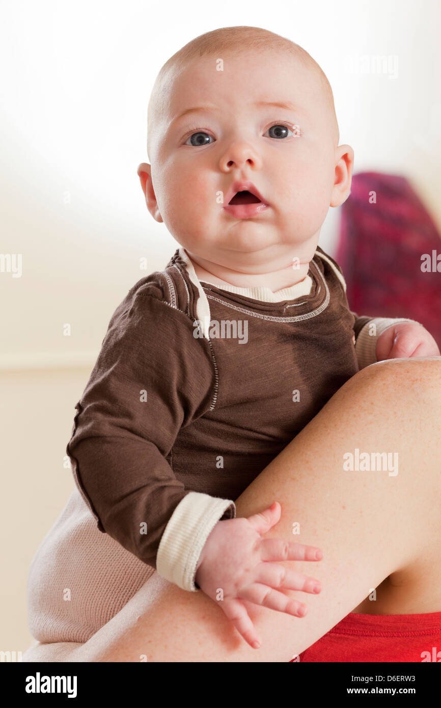 Portrait mothers holding children 2 5 months hi-res stock photography ...