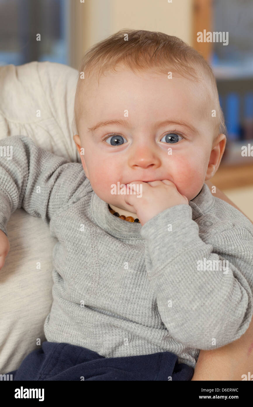 Baby biting on fingers hi-res stock photography and images - Alamy