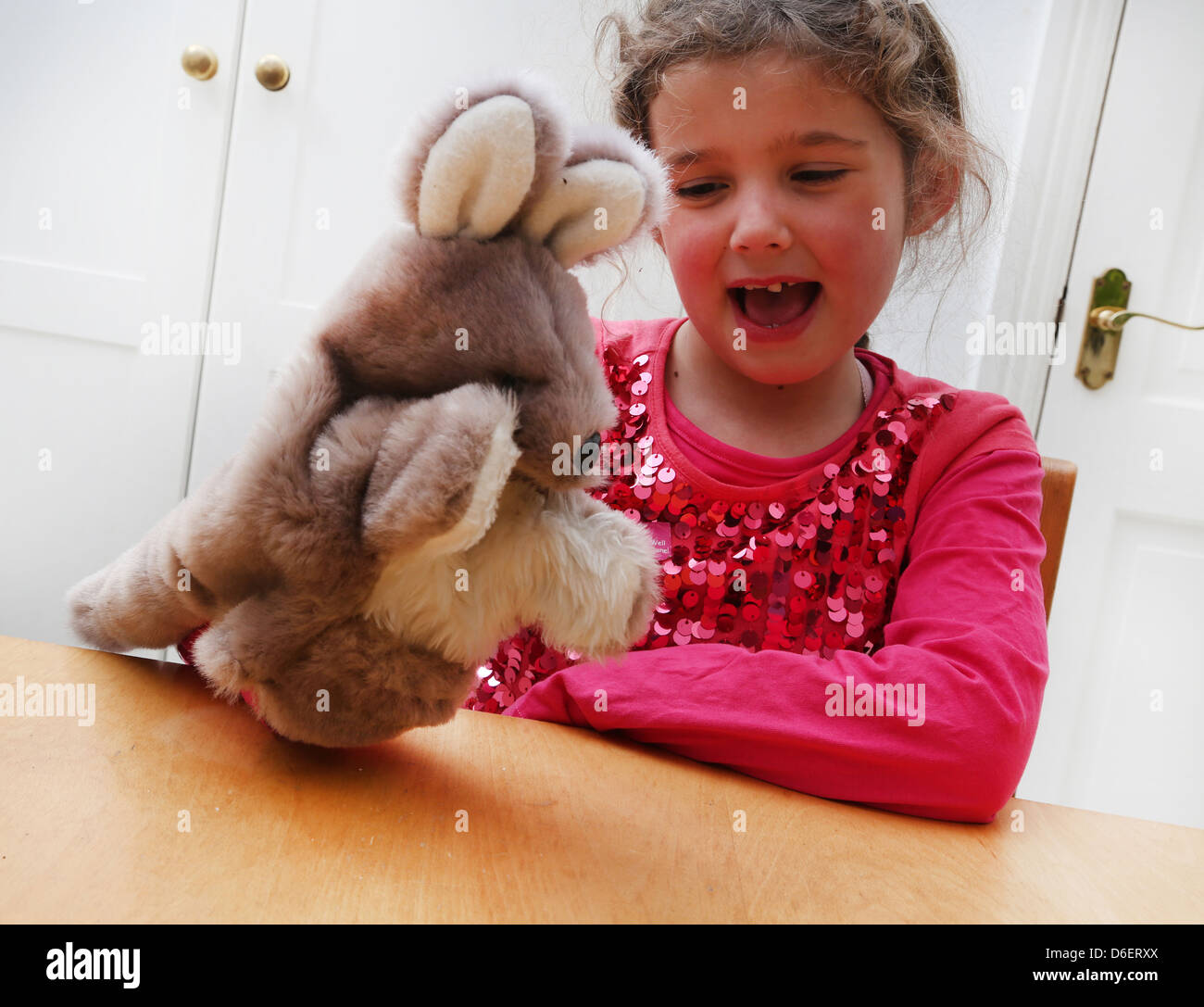 7 Year Old Girl Playing With Kangaroo Hand Puppet England Stock Photo ...