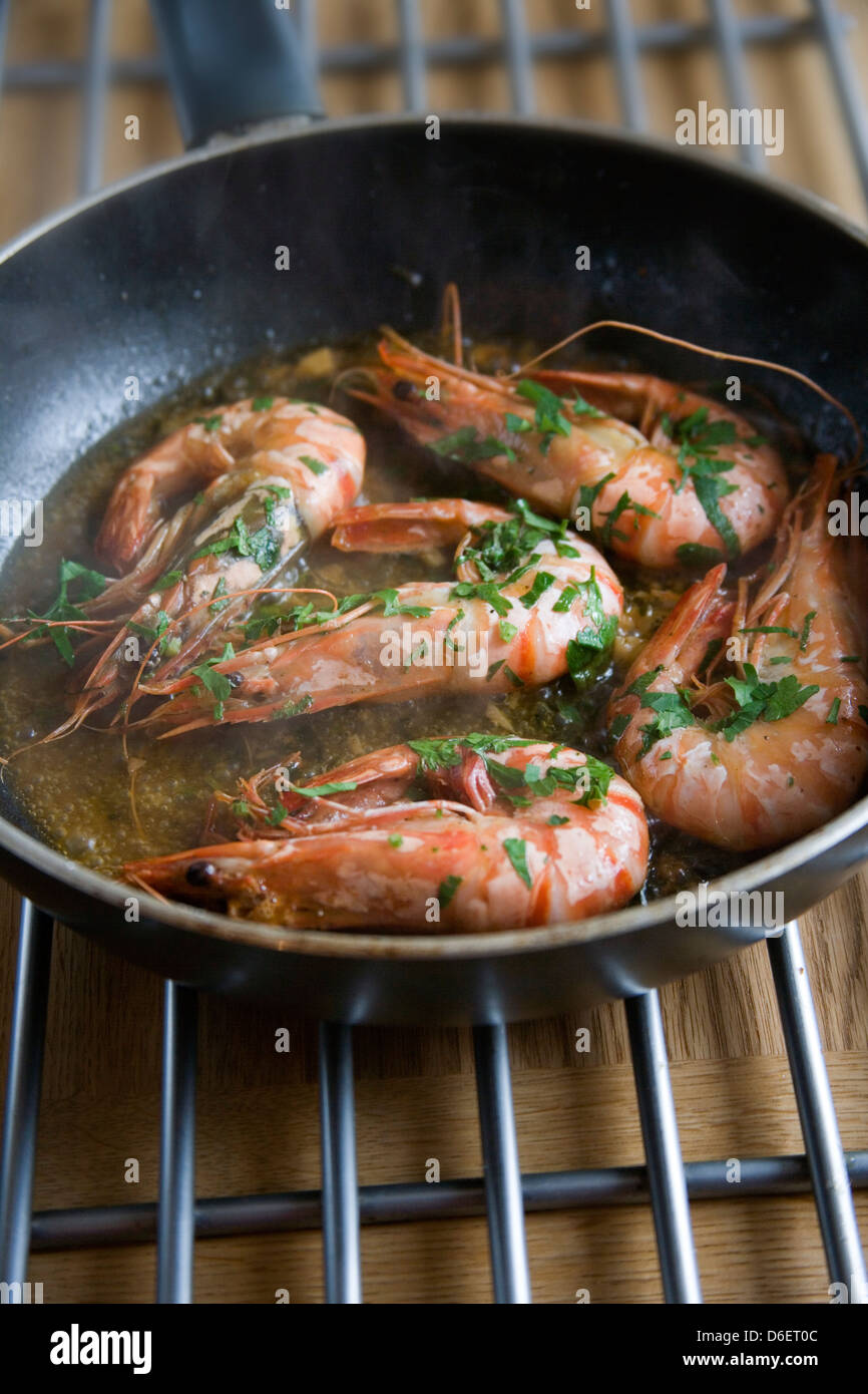 King prawns cooked in olive oil, lemon/ garlic/parsley/ step shot Stock ...