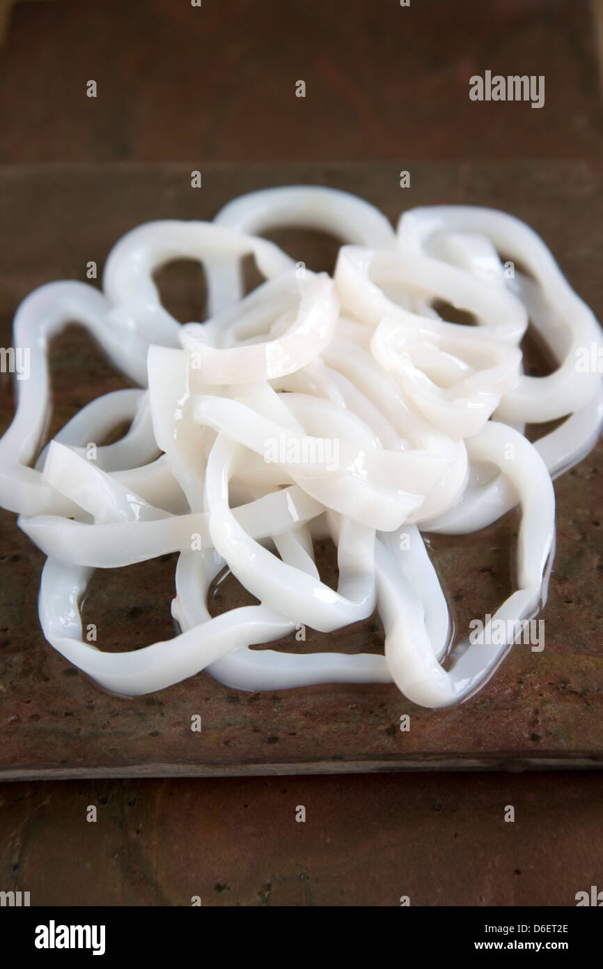 Raw squid rings hi-res stock photography and images - Alamy